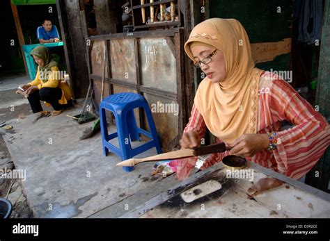 Female Kris Maker Hj Mariana Left And Amah Right Making Kris Sheaths In The Kris Market