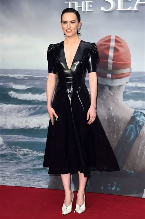 Daisy Ridley Slips Into A Plunging Latex Gown With A Skintight Corset
