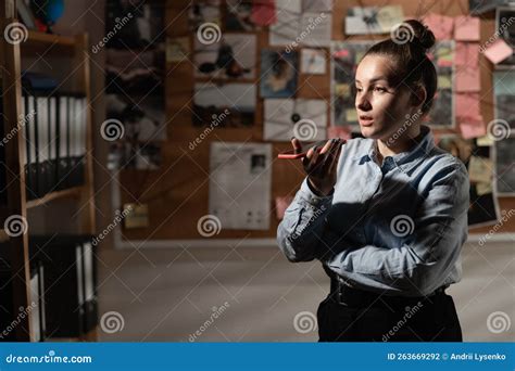 Detective Working At Desk In Her Office Use Cellphone Talk On Loudspeaker Or Activate Digital