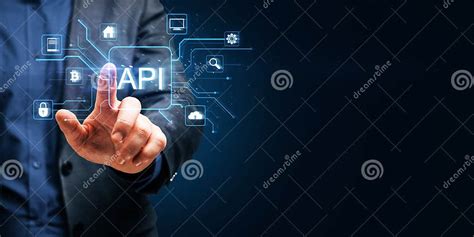 Businessman Interacting With Api Icon And Connected Symbols On A Blue Digital Background Stock