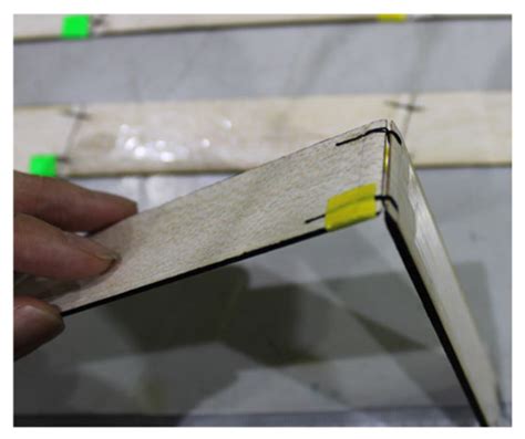 Coupled Aerodynamics Structure Analysis And Wind Tunnel Experiments On Passive Hinge Oscillation