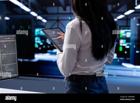 Engineer Doing Yearly Checkup To Prolong Data Center Electronics Life