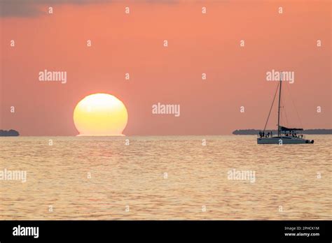 Boat During Sunset In Key West Florida Watch As The Sun Sets Over The