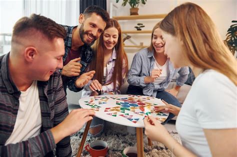 Playing Smart Game Group Of Friends Have Party Indoors Together