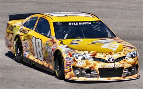 Kyle Buschs Vibrant Yellow 18 Nascar Racing Car Wallpaper Wallpapersok