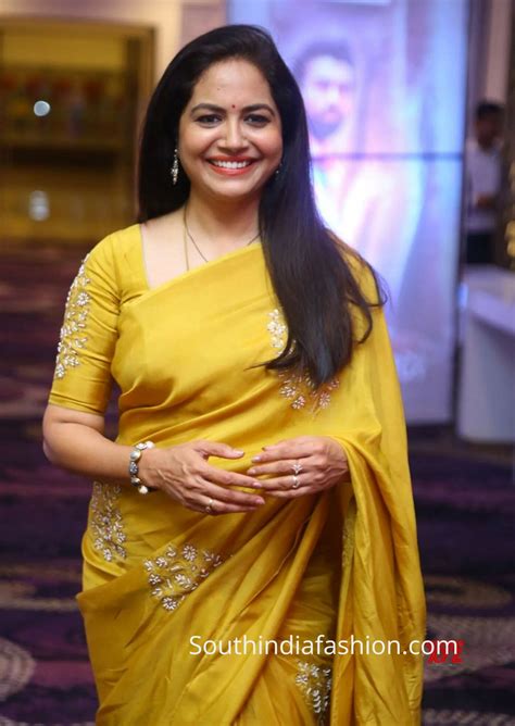 Singer Sunitha Shines In Mustard Yellow Elegance At Sarkaru Naukri Movie Press Meet South