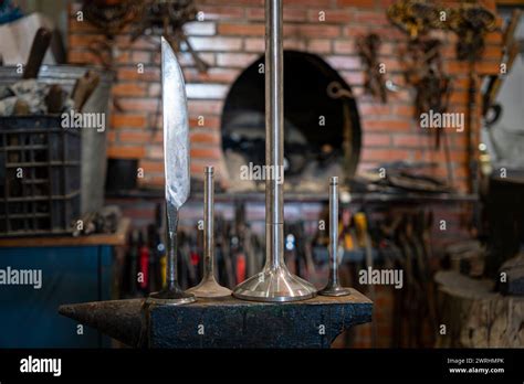The Blade And Blanks For Forging A Knife On An Anvil Against The Background Of A Blast Furnace