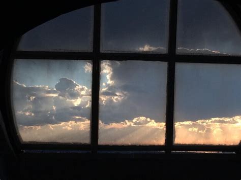 Premium Photo Clouds Seen Through Glass Window