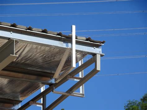 Installation Of The Aluminum Cladding Frame At The End Of The Roof Is