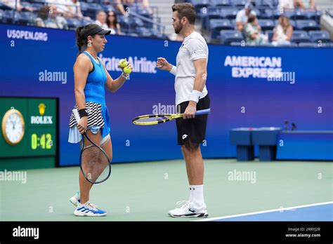 Jessica Pegula And Austin Krajicek In Action During A Mixed Doubles