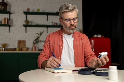 Diabetic Man Checking Level Of Sugar In Blood With Glucometer Takes