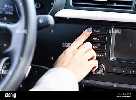 Woman Pressing Radio Button On Car S Control Panel Stock Photo Alamy