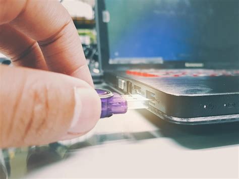 Premium Photo Close Up Of Person Inserting Usb Stick In Laptop