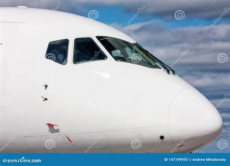 Close View Of The Cockpit Of A White Passenger Plane Outside Stock