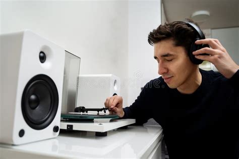 Turns On A Vinyl Needle Player And Speaker System Musician Set Up New Vinyl Record Player With