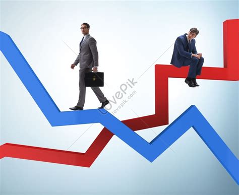 Businessman Holding Graphs Showing Growth And Decline Picture And Hd Photos Free Download On
