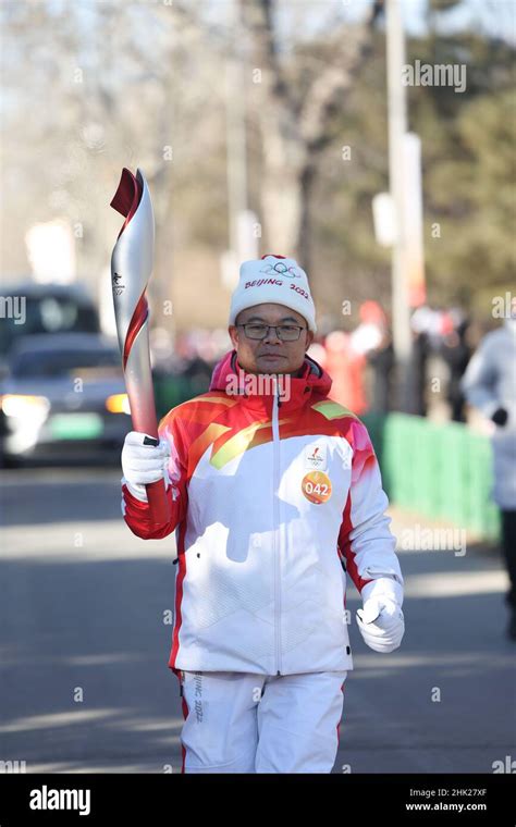 beijing china 2nd feb 2022 torch bearer lin jingzhen runs with the