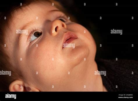 Cute Bavy Face With Big Brown Eyes Long Eyelashes And Blond Hair Looking Up Amazed Into The