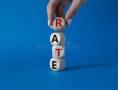 Rate Symbol Concept Word Rate On Wooden Cubes Businessman Hand