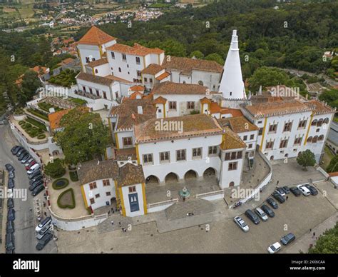 Aerial View Of A Historic Castle With Striking White Towers And