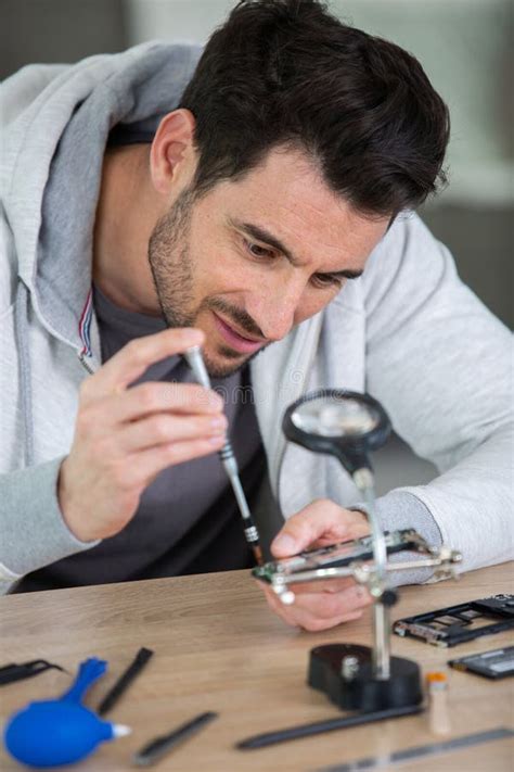 Man Disassembling Smartphone In Repair Shop Stock Photo Image Of Business Expertise