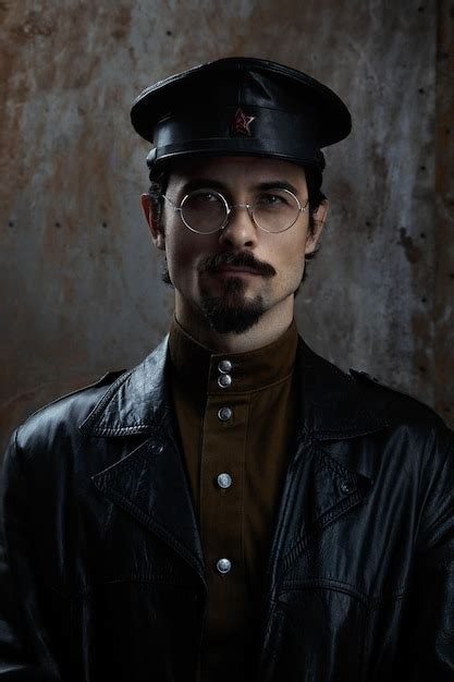 Premium Photo Portrait Of Man Wearing Costume Standing Against Wall