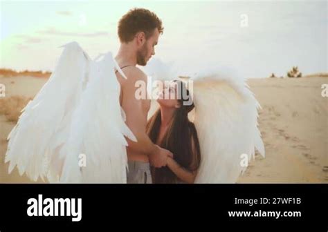 Embrace Hug Heaven Angels With White Wings Man Holding A Womans Hand