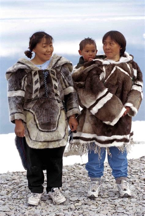Inuit Women Wearing Traditional Clothes Made From Seal And Caribou