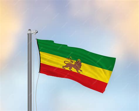Waving Rastafarian Flag On A Flag Pole Premium Photo