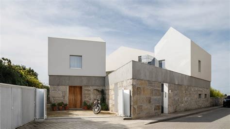 Paulo Merlini Perches Gabled Volumes On Top Of Stone Plinth At Casa Rio