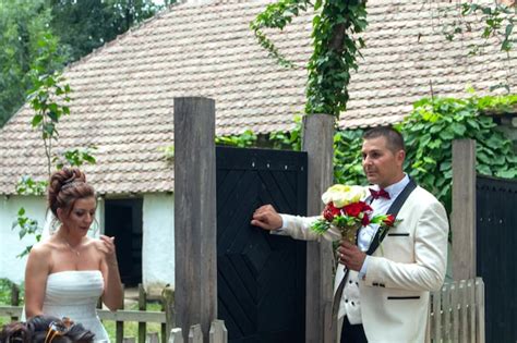 Premium Photo Couple Standing Against Built Structure