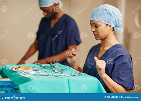 Double Checking That Every Surgical Instrument Is Accounted For A Surgeon Deciding Which