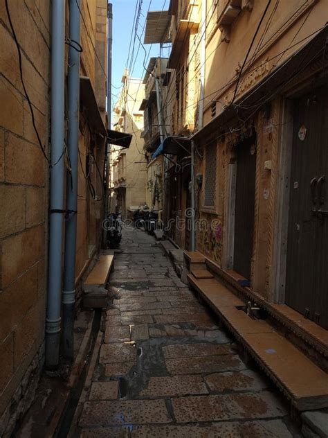 Narrow Stone Alley In Jaisalmer With Scooters And Play Of Light And