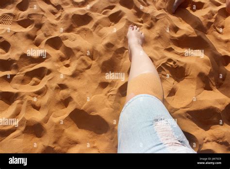 Sand Stick On A Girl S Leg At Red Sand Dunes In Shadow And Sunlight Mui Ne Stock Photo Alamy