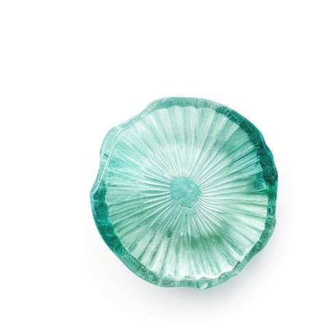 Premium Photo A Green Glass Shell With A Design On It