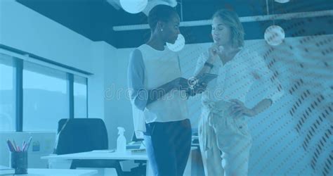 animation of graphs and globe over diverse female coworkers in office