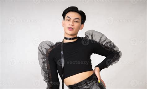 Portrait Of A Feminine Man In Black Dress And Black Hair While Wearing