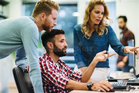 Software Engineers Working On Project And Programming In Company Stock
