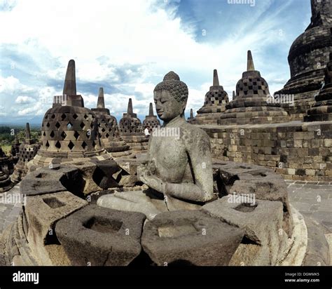 Exposed Buddha Statue In The Temple Complex Of Borobudur Stupas