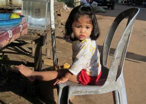 Cambodian Girl In Khmer Dress Standing In Bayon Temple In Angkor City