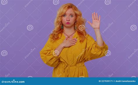 Sincere Responsible Redhead Girl Raising Hand To Take Oath Promising