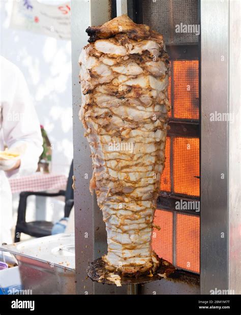 Turkish Shawarma Roasting On Vertical Skewer Grilled Skewered Chicken On Spit A Traditional