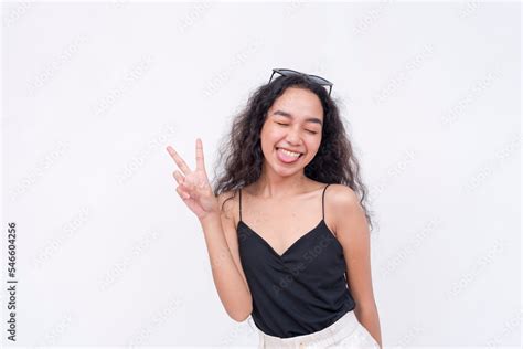 Poster A Cute And Spunky Filipino Woman Sticking Her Tongue Out While