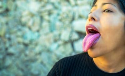 Dark Skinned Young Latin Woman With Her Mouth Open Showing Her Sensual