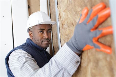 Man Laying Rockwool Panels In Attic House Stock Photo Image Of Improvement Saving 265339312
