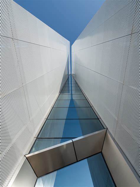 Aoe Covers Exhibition Centre In China With White Perforated Metal