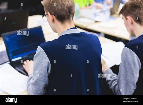 Software Developer Students In Auditorium Hall Working On Computer And