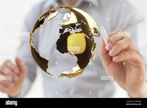 Businessman Tapping On A Floating Render Of A Globe With A Stylus