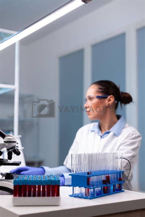 Microbiology Scientist Typing Biochemistry Discovery Experiment At