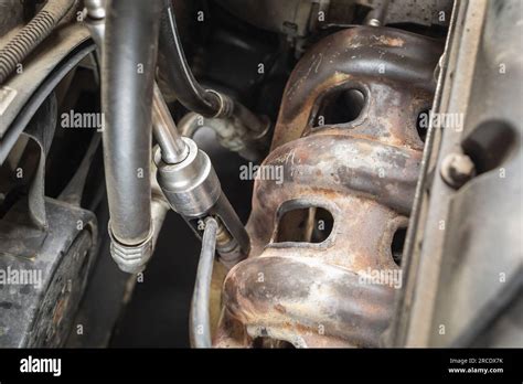 The Workflow Of Unscrewing The Oxygen Sensor Of A Passenger Car For Replacement Stock Photo Alamy